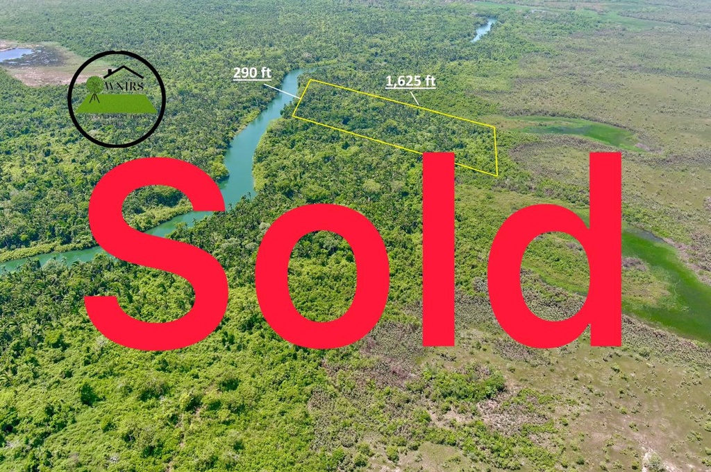 10.0 acres situate along the East side of the Belize river, in the ...